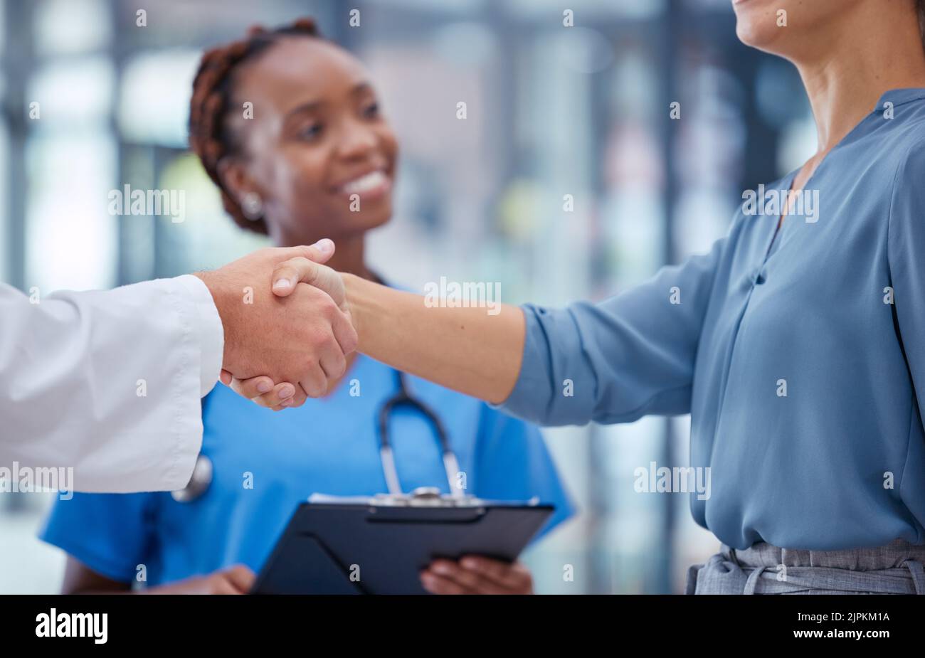 Doctors handshake thank you, greeting or good medical breakthrough ...