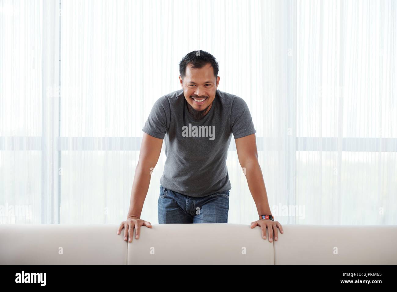 Portrait of grinning Filipino man looking at camera Stock Photo - Alamy