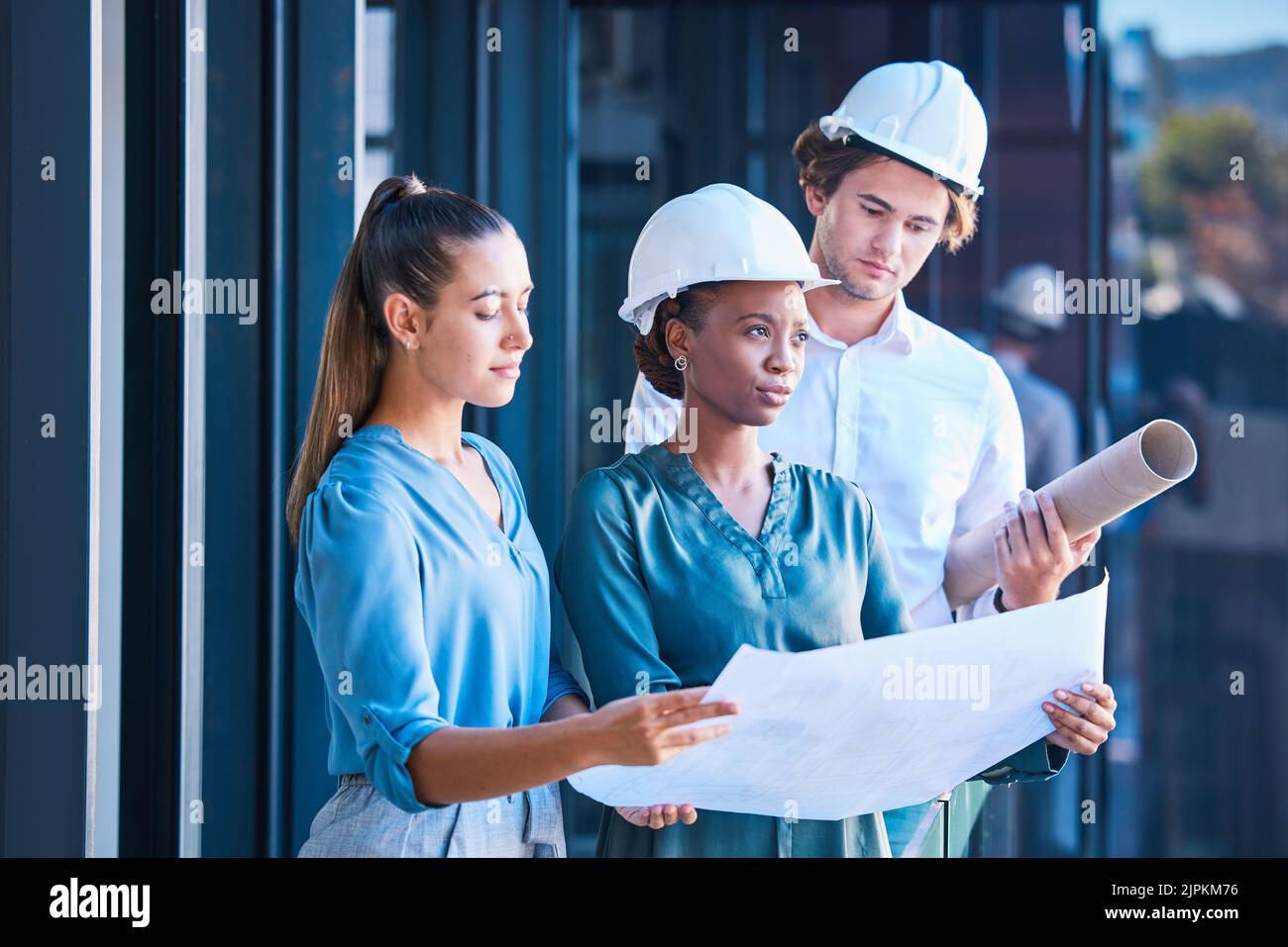 Engineer, architect or designer team looking at blueprint, design ...