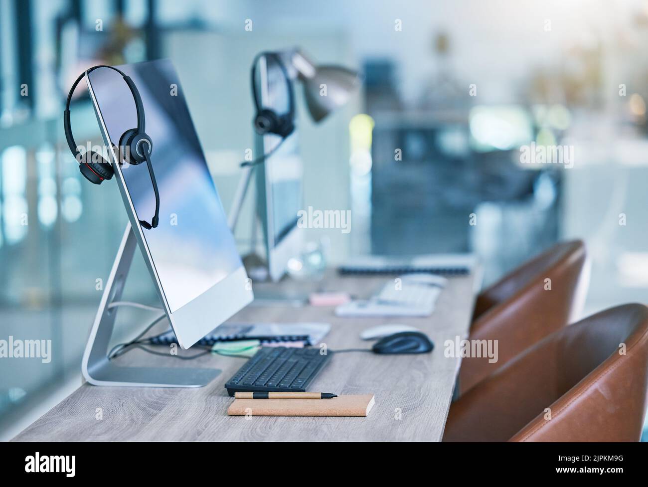 Headphone or headset in an empty call center office with computer ...