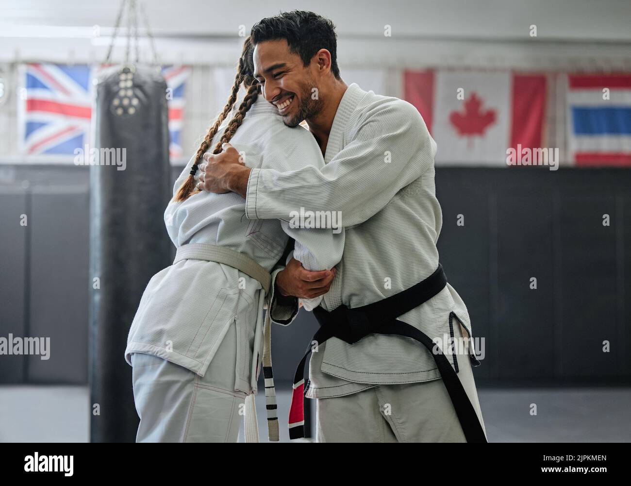 . Karate trainer giving hug to female student for motivation, coach ... . Karate trainer giving hug to female student for motivation, coach ...
