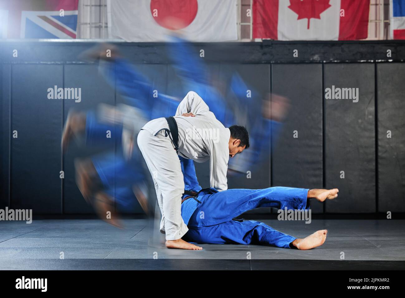 . MMA, fitness and exercise with a teacher and student training in a ...
