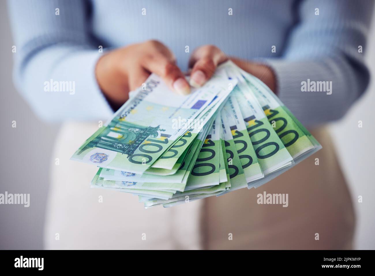 Finance, bonus and investment hand holding money, cash or bank notes ...