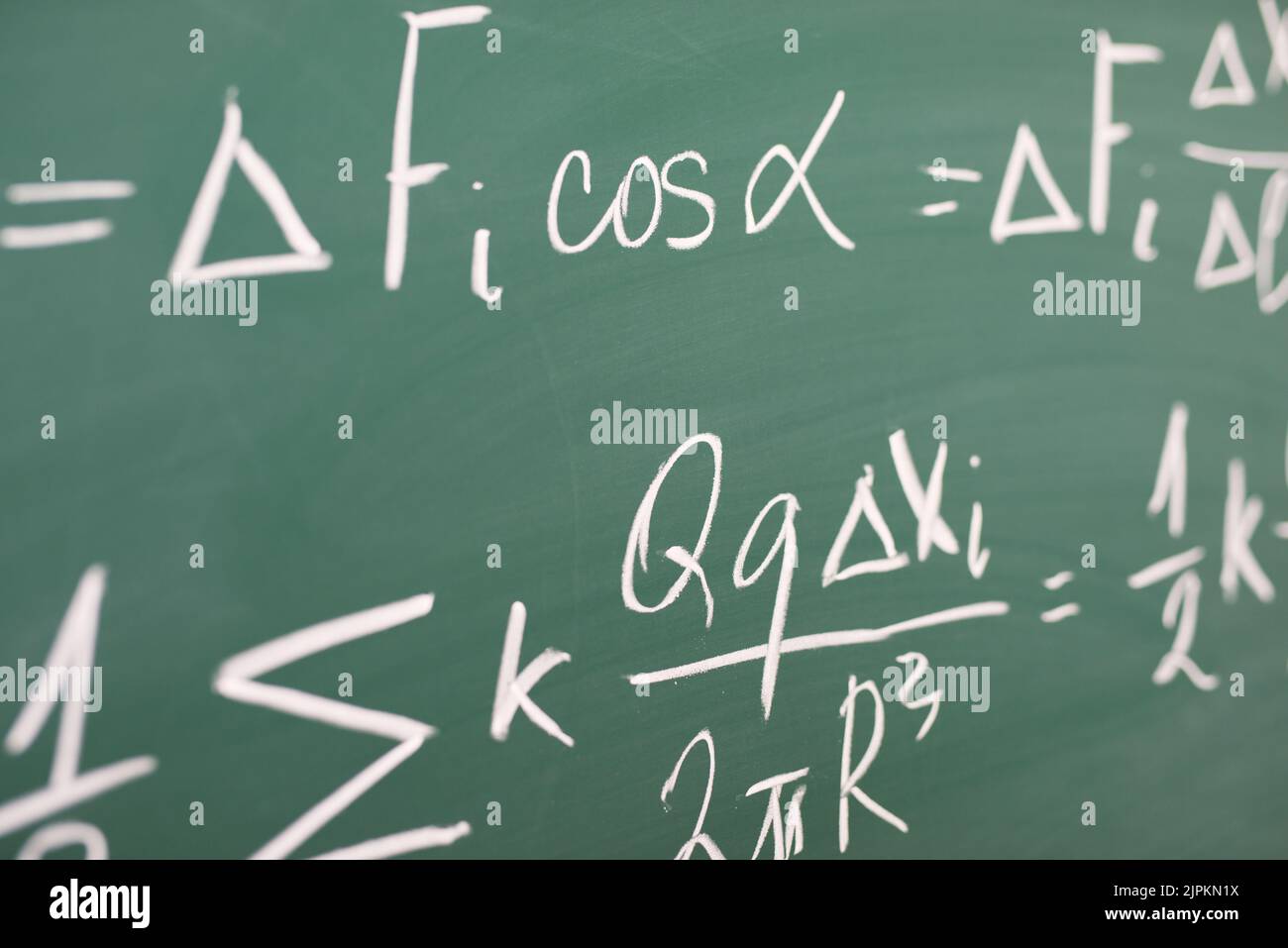 Formulas written by chalk on chalkboard Stock Photo - Alamy