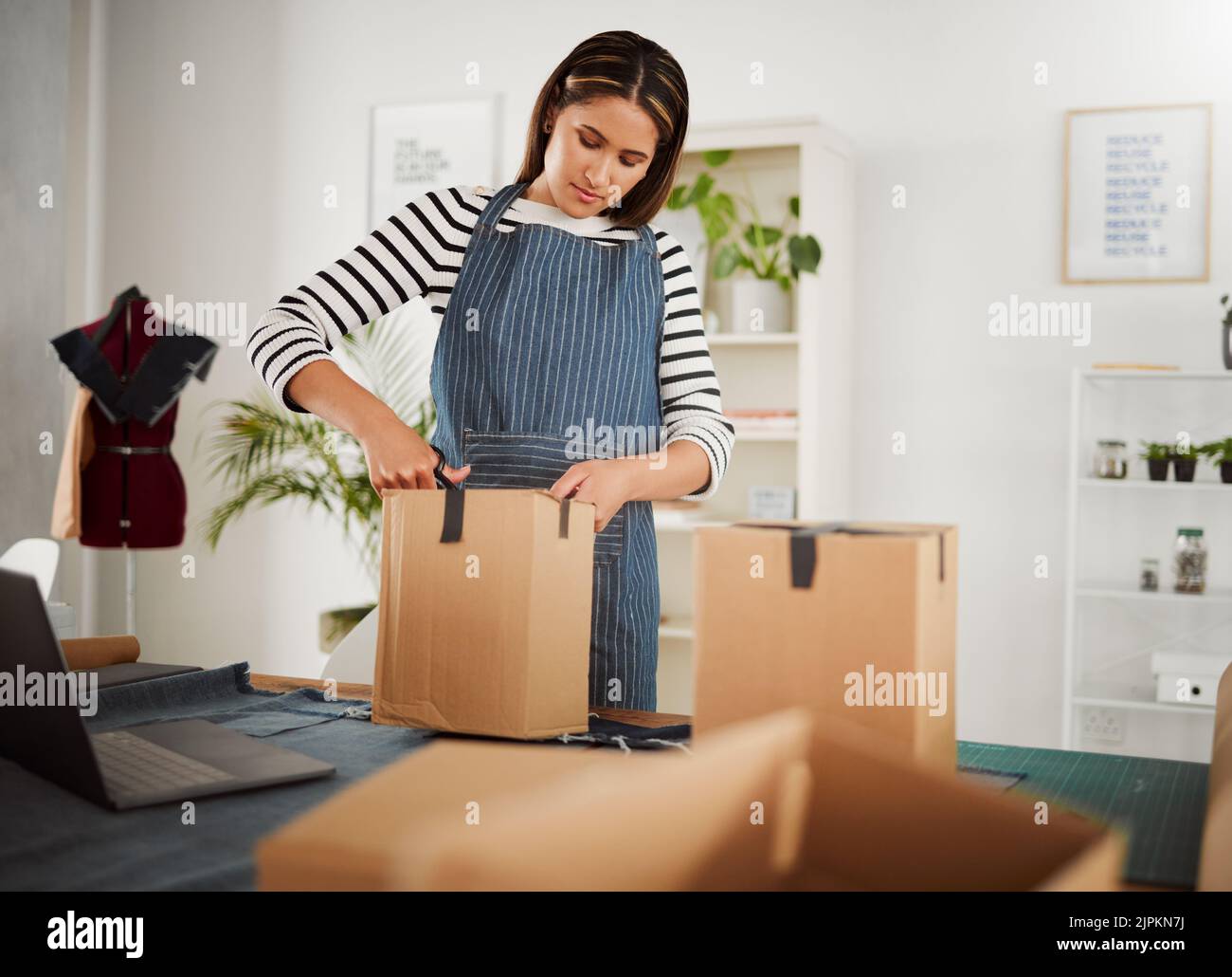 Female worker packing box in warehouse hi-res stock photography and ...