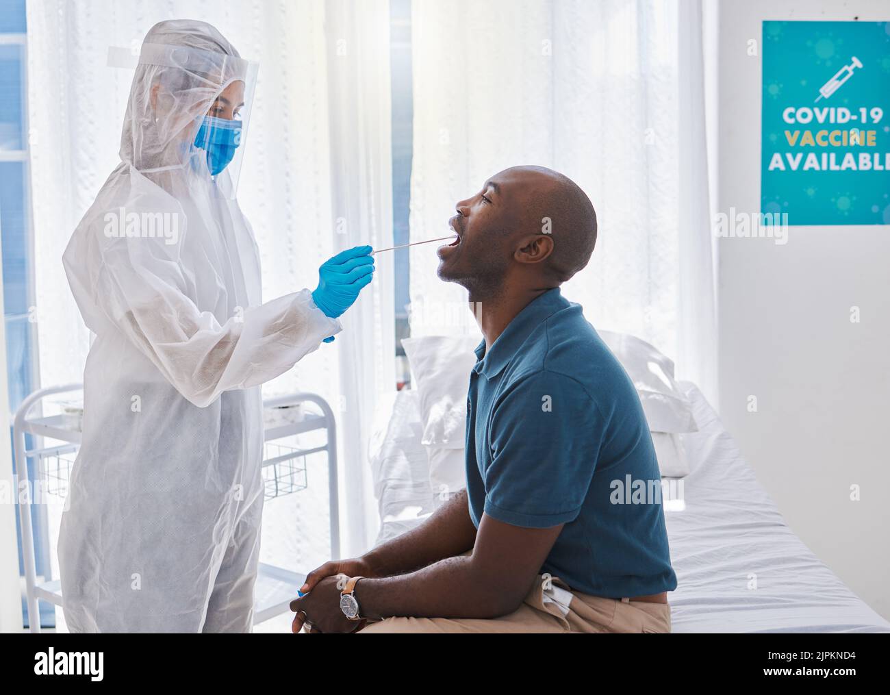 Nurse collecting a covid, flu or disease sample with a cotton swab from ...