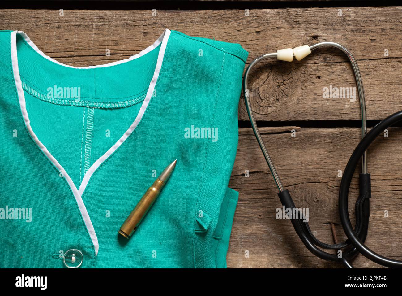 A medical uniform on which a bullet flies and a stethoscope on the ...