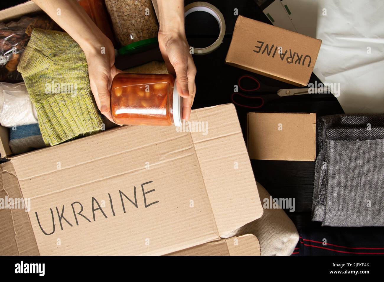 Collecting a humanitarian food set to help people who suffered during ...