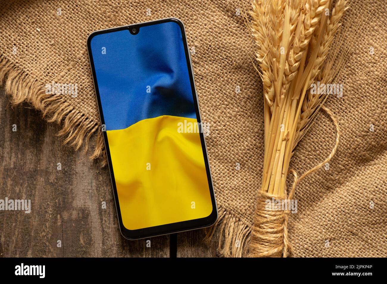 The national flag of Ukraine as a background on the phone, peace in ...