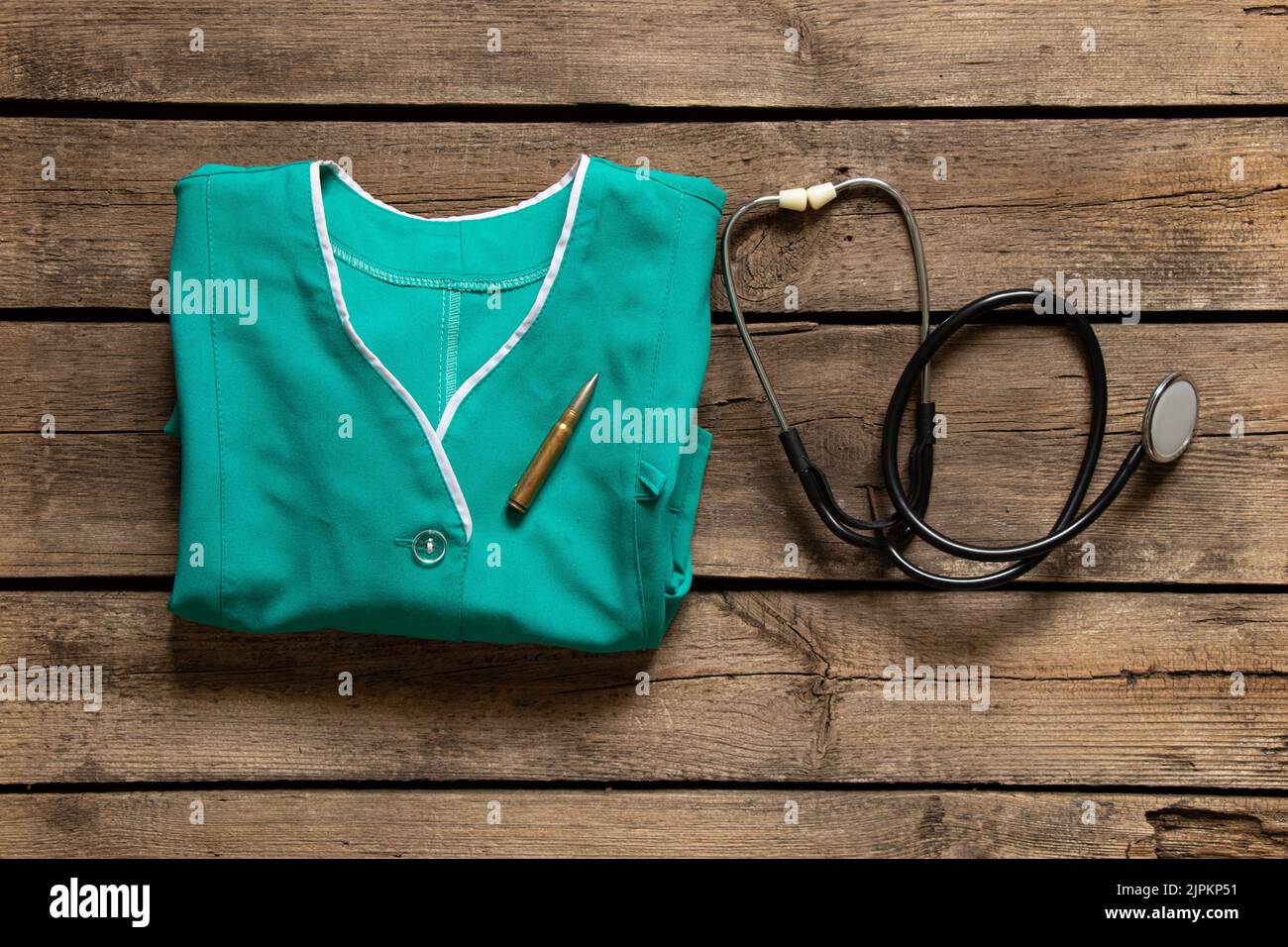 A medical uniform on which a bullet flies and a stethoscope on the ...