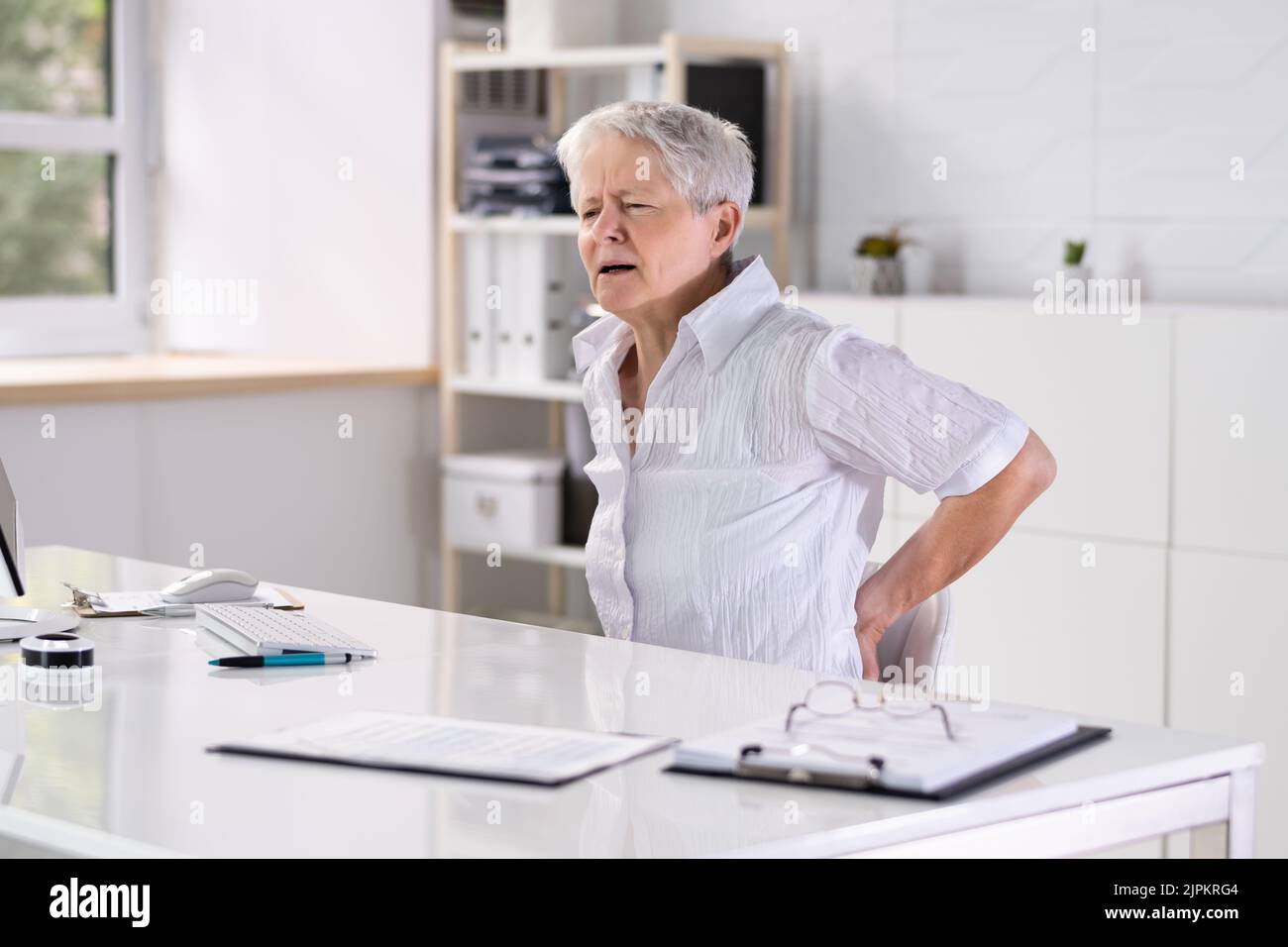 Woman With Back Pain. Bad Office Posture Stock Photo - Alamy