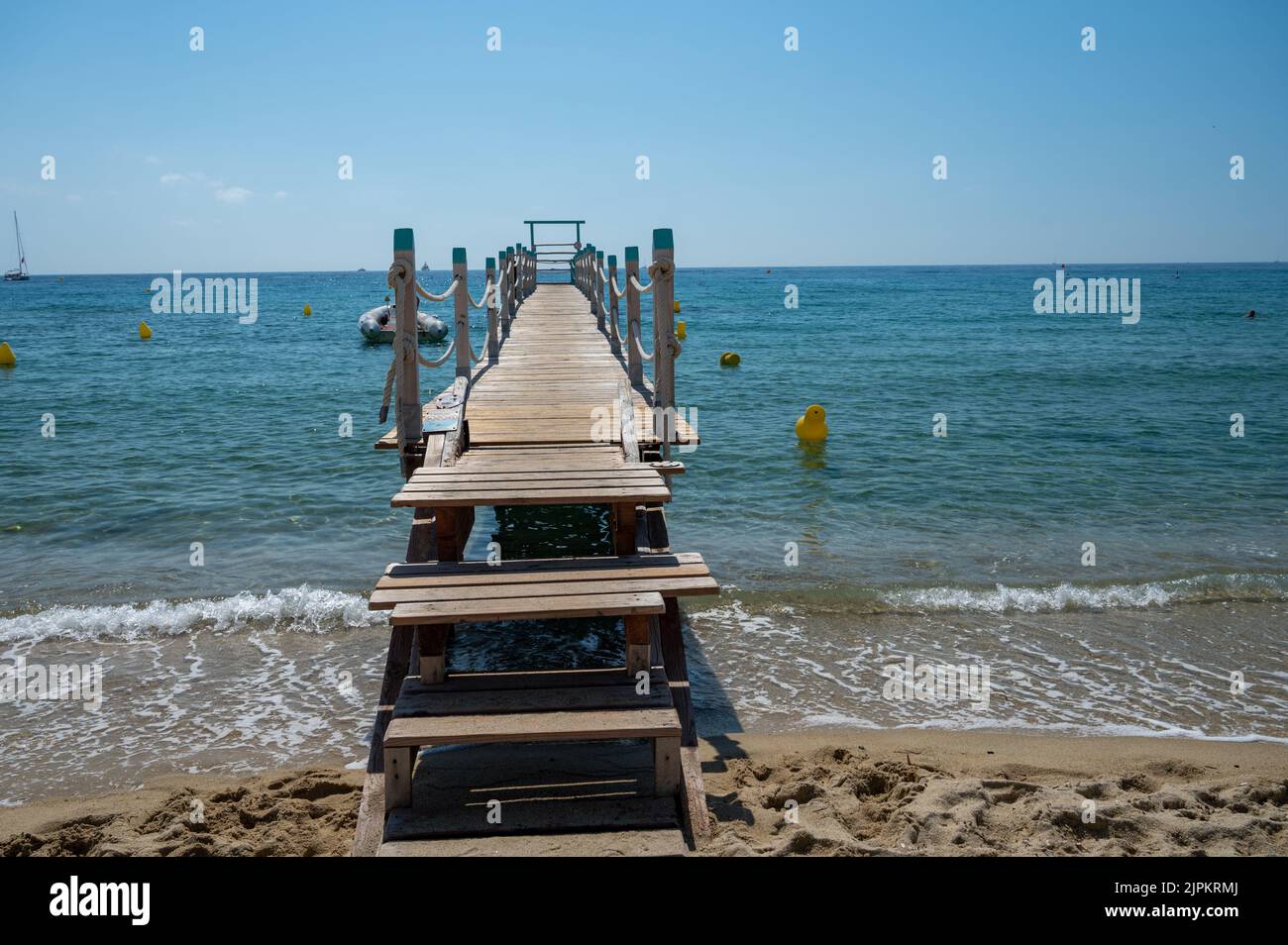 Wooden pier for guests of yachts on legendary Pampelonne beach near ...