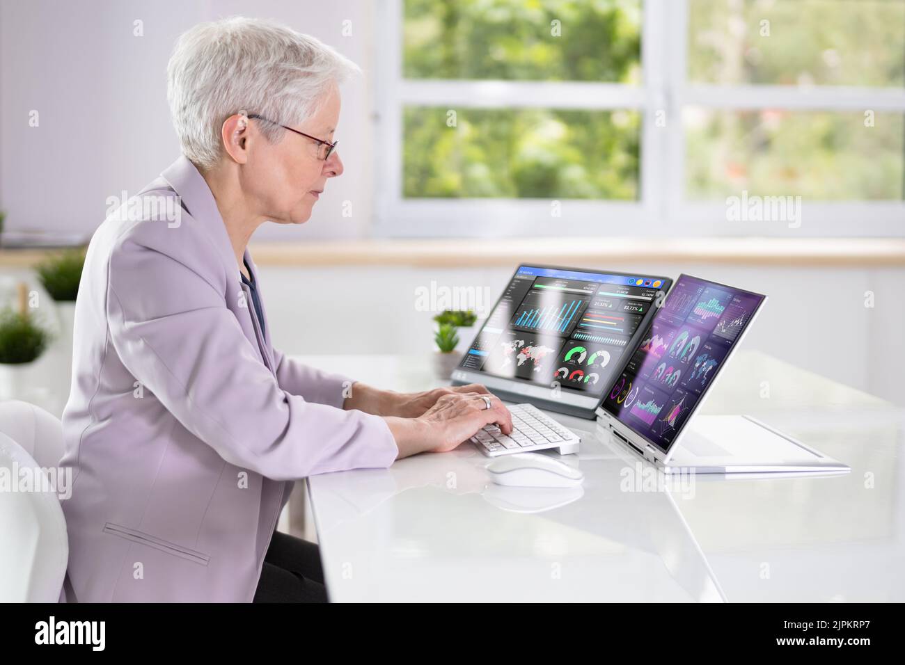 Analyst Women Looking At KPI Data On Laptop Screen Stock Photo - Alamy