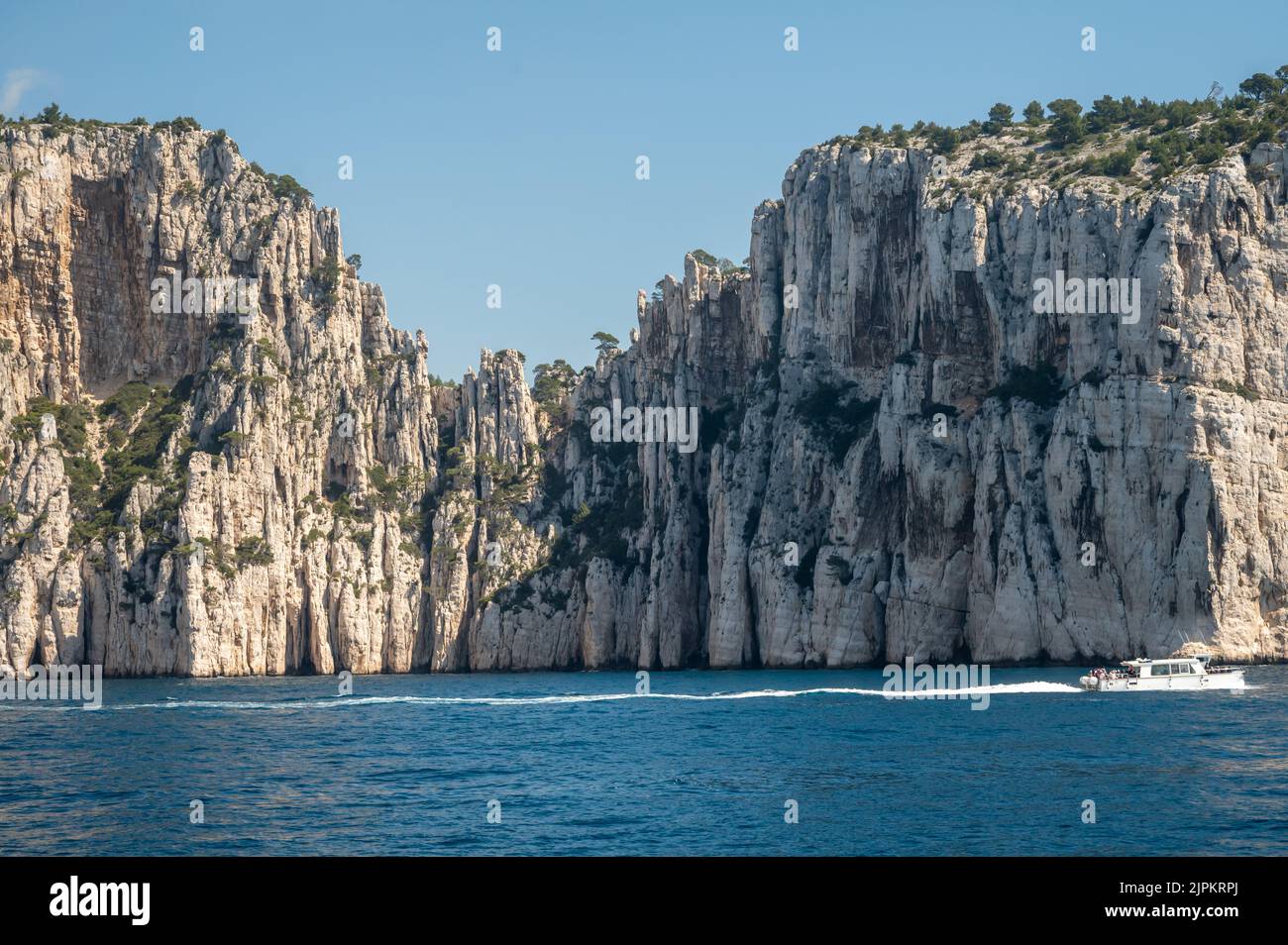 Limestone cliffs and blue sea near Cassis, boat excursion to Calanques ...