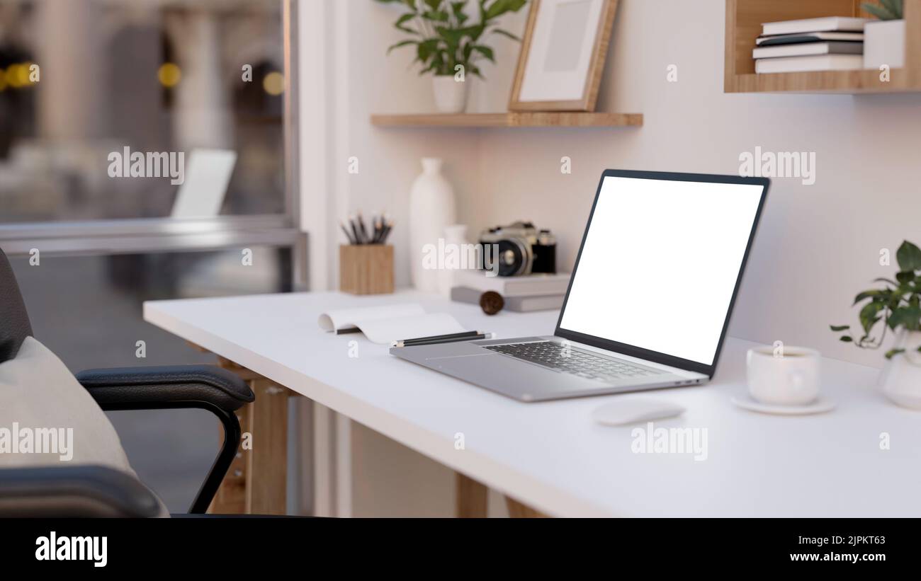 Notebook laptop white screen mockup is on a modern white office desk ...