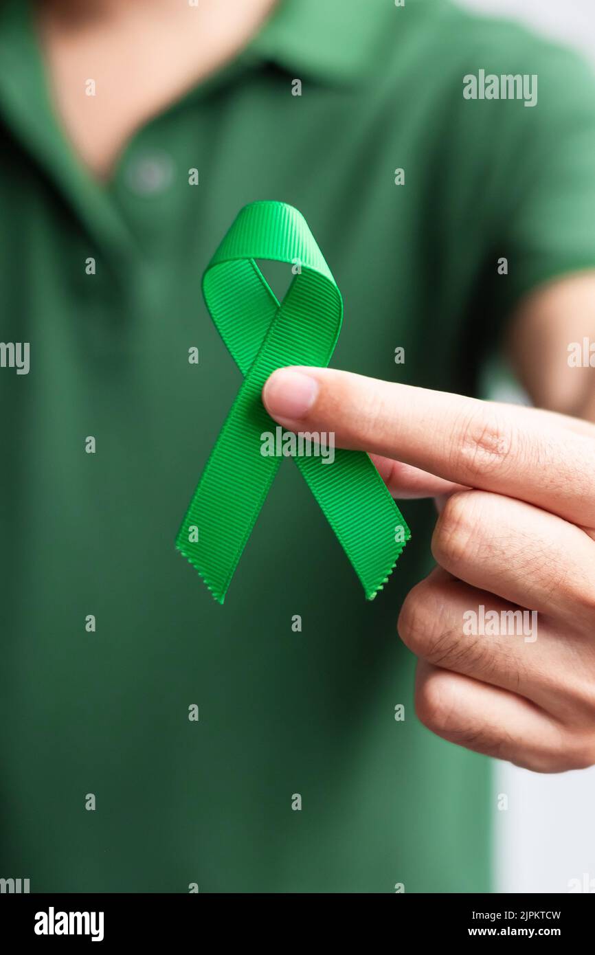 Hand holding green Ribbon for Liver, Gallbladders, bile duct, cervical ...