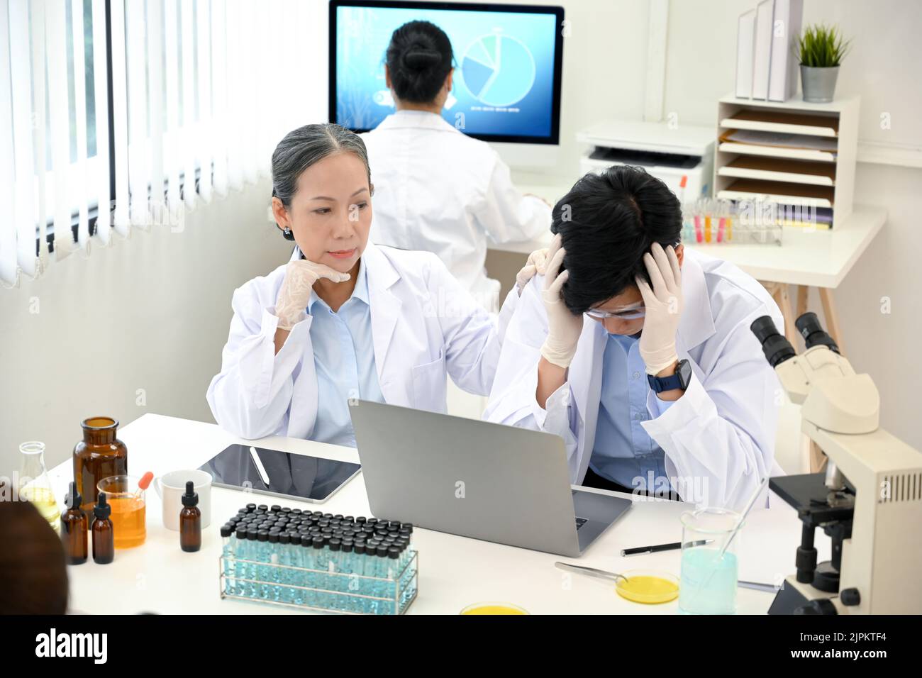 Stressed and serious millennial Asian male scientist upset with his ...