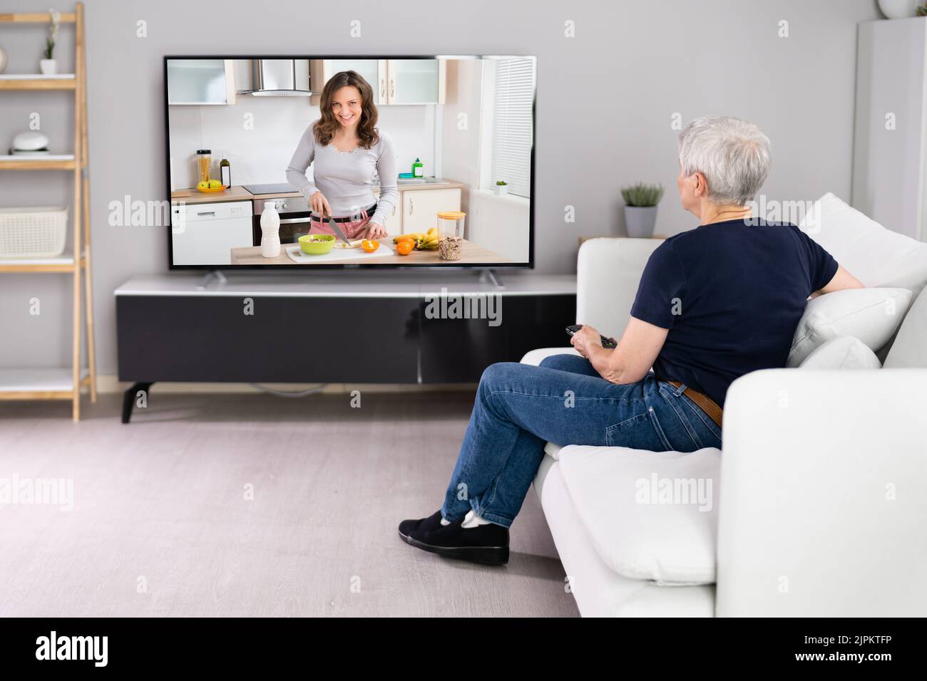 Elderly lady watching tv hi-res stock photography and images - Alamy