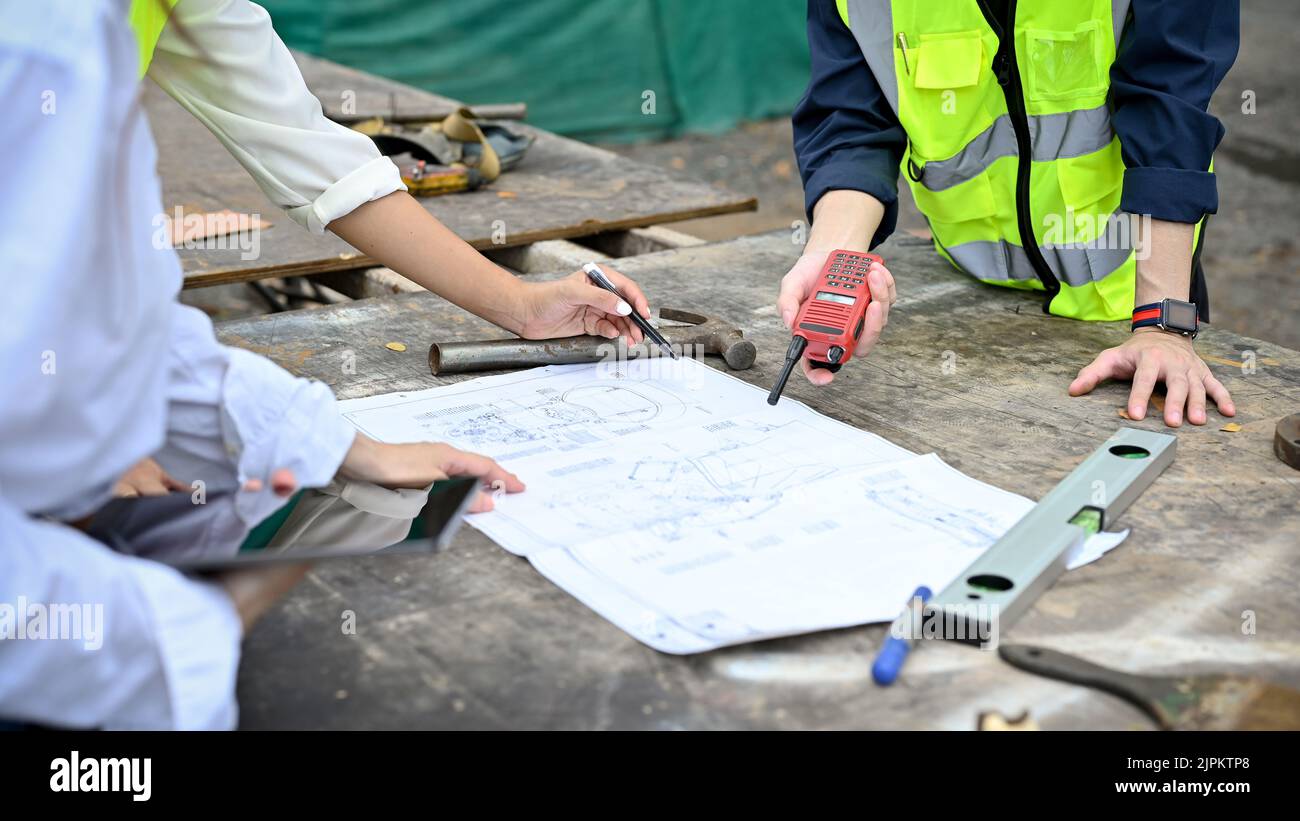 Team of professional civil engineer looking at the blueprint and ...