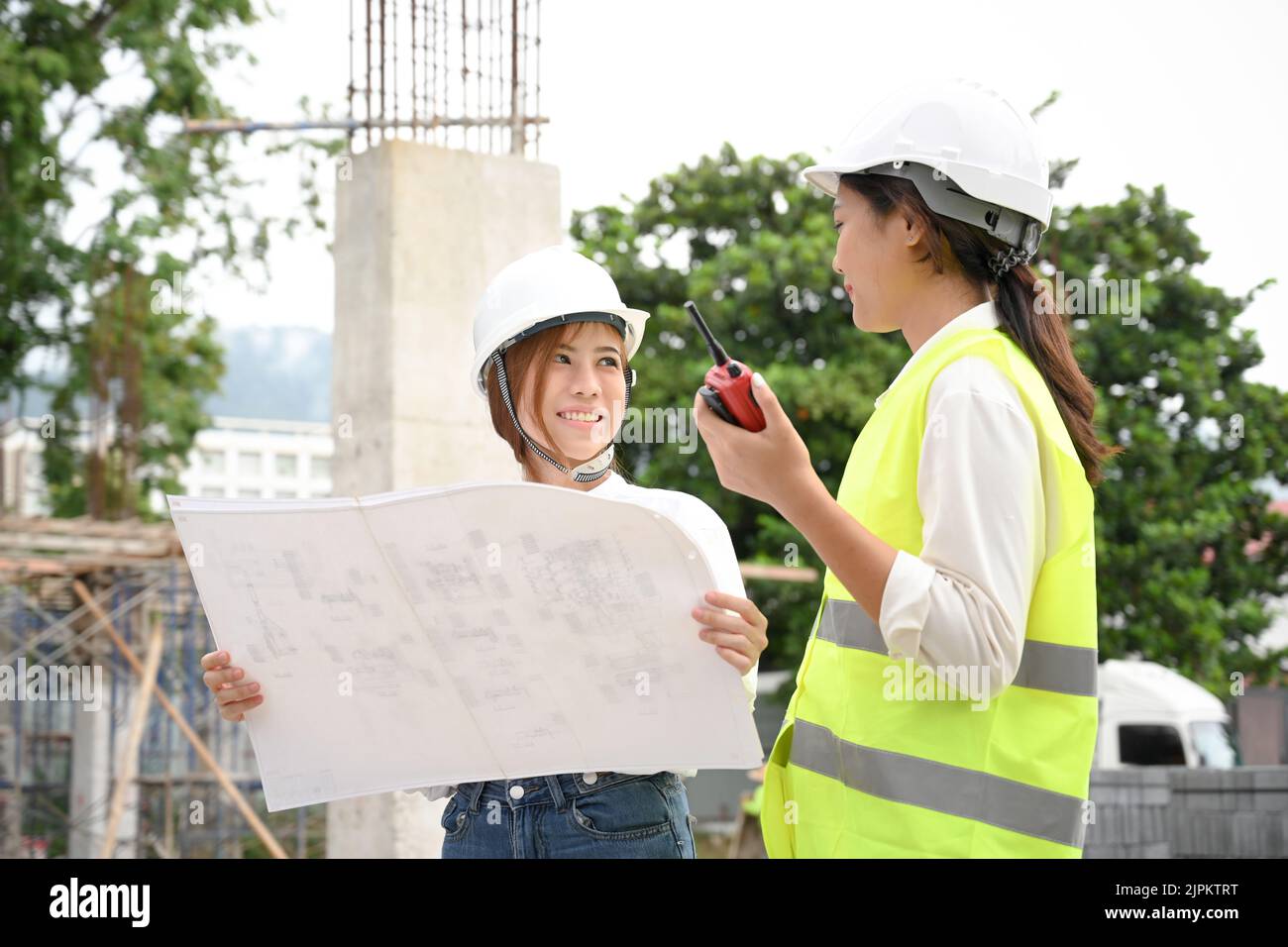 Beautiful and talented young Asian female architect having a nice ...