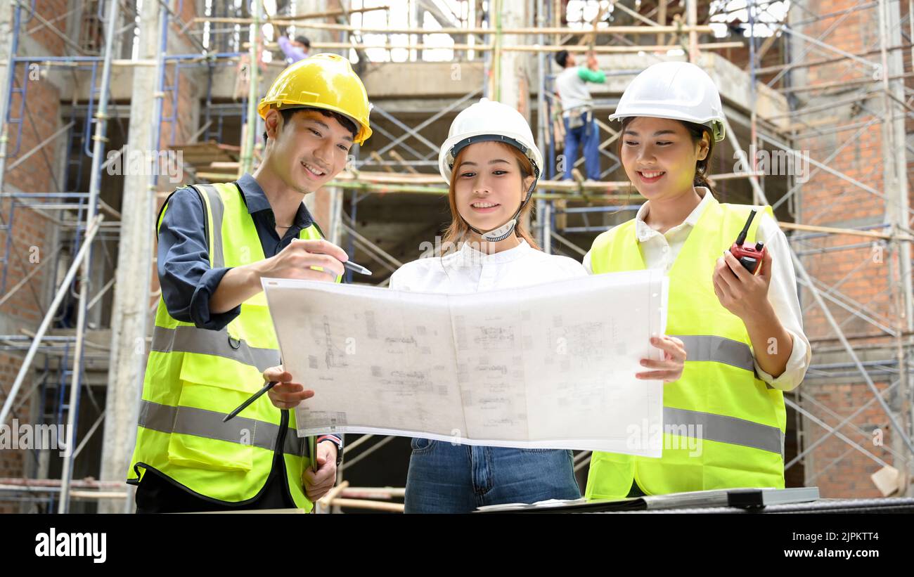 A team of construction inspector explaining the building process on the ...