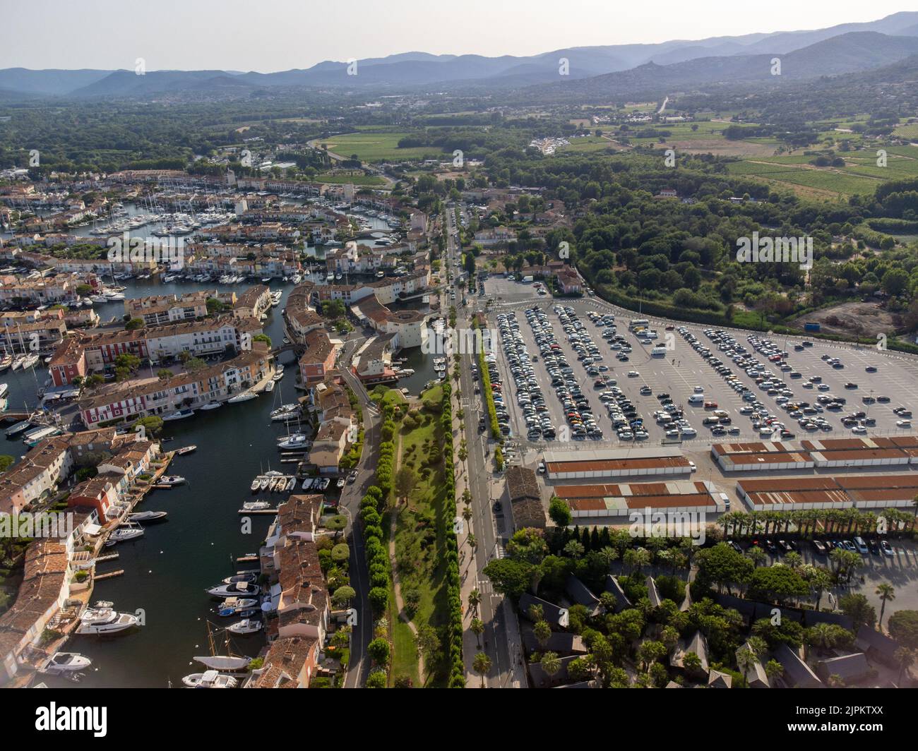 Aerial view on blue water of Gulf of Saint-Tropez, sail boats, houses ...