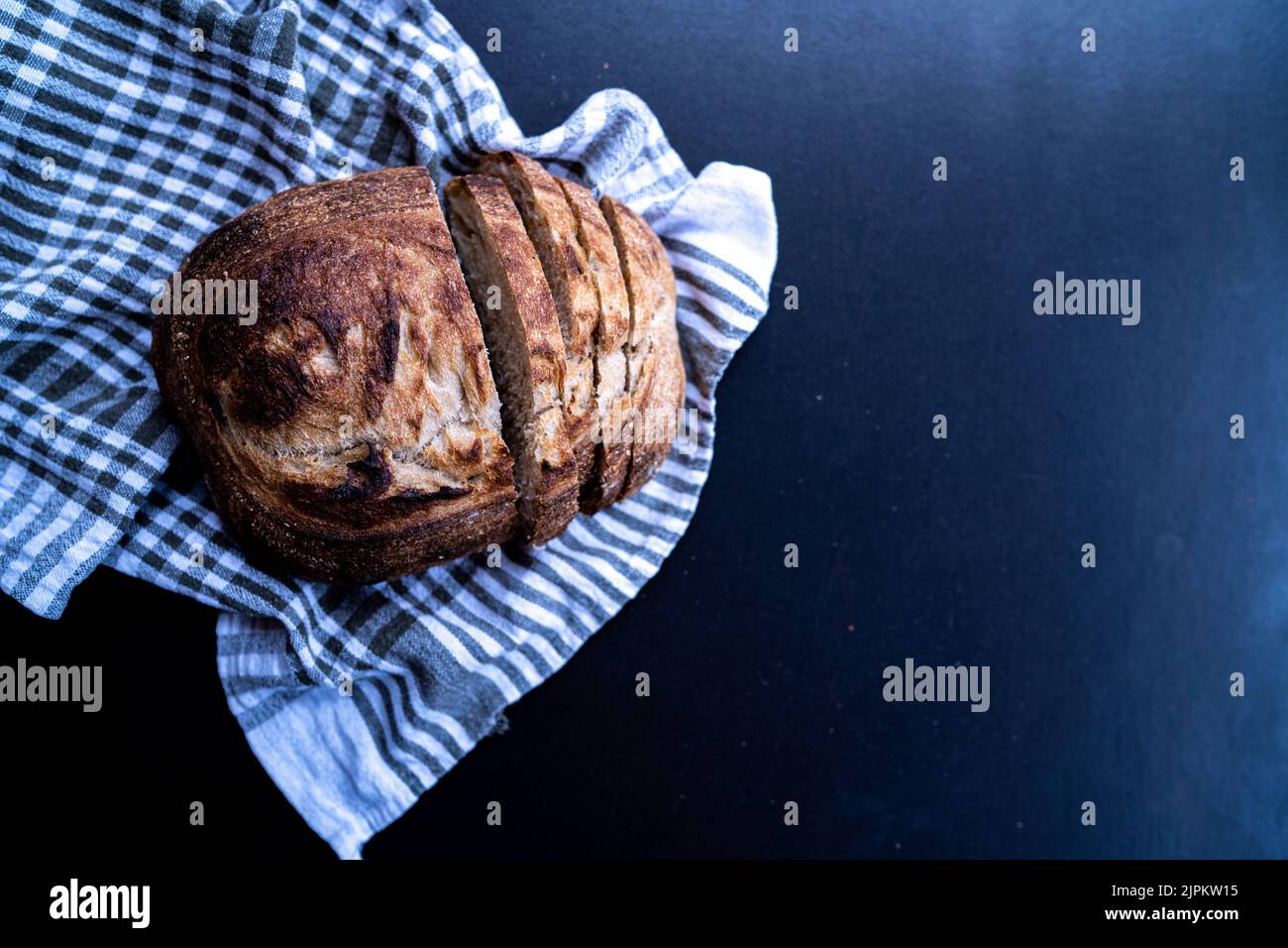 A top view of artisanal rye bread in a sliced form on a towel Stock ...