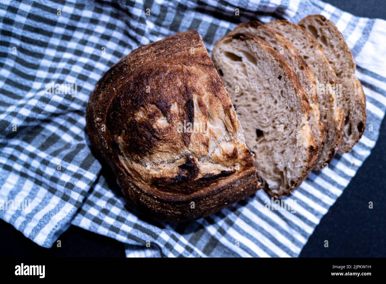 A top view of artisanal rye bread on a towel in a sliced form Stock ...