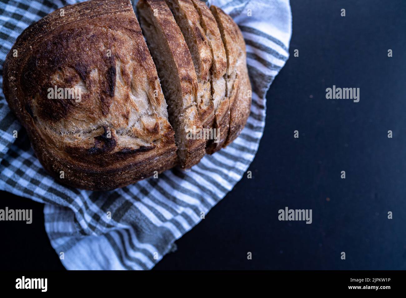 A top view of artisanal rye bread in a sliced form on a towel Stock ...