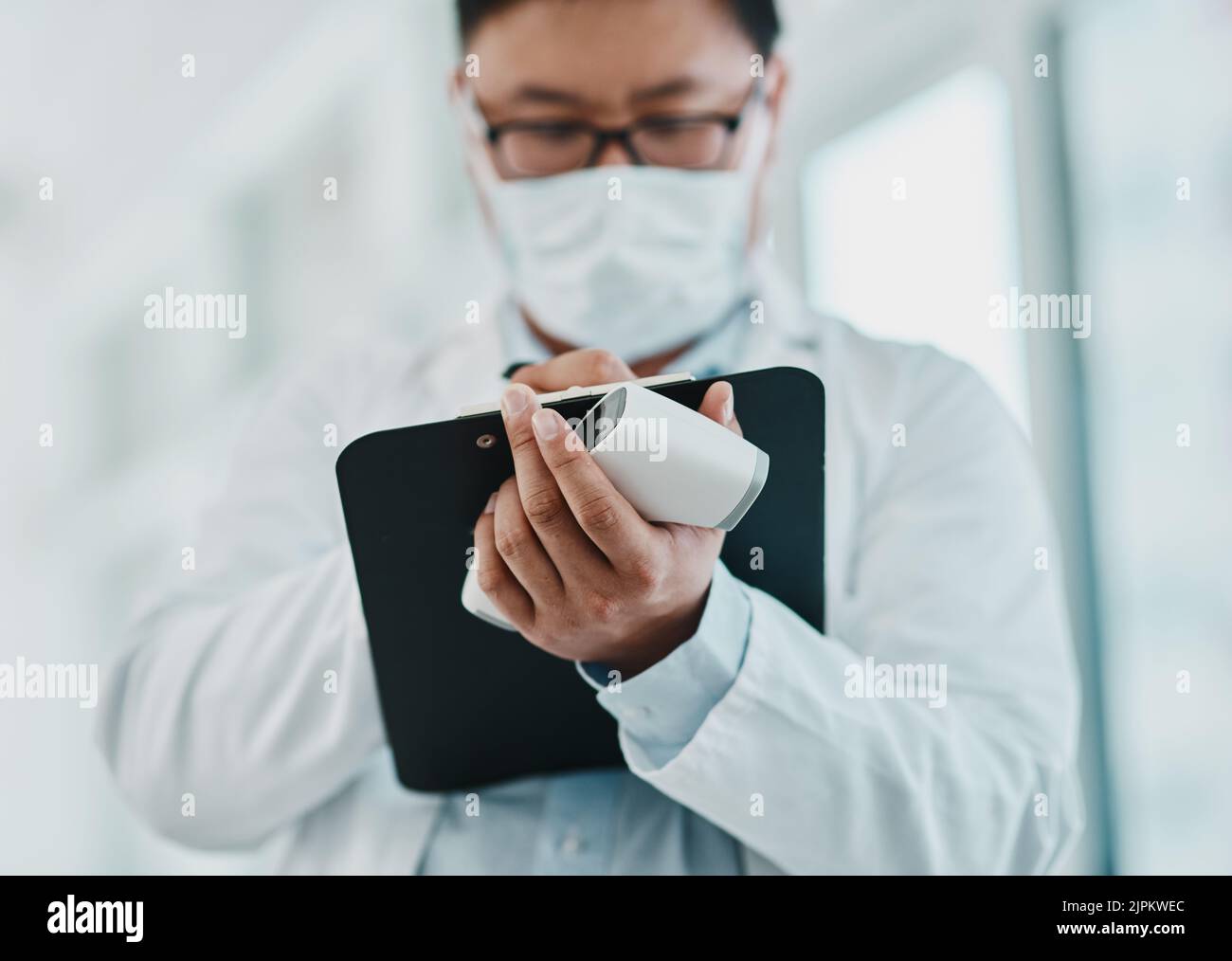 Covid, pandemic and virus, doctor or medical healthcare worker writing ...