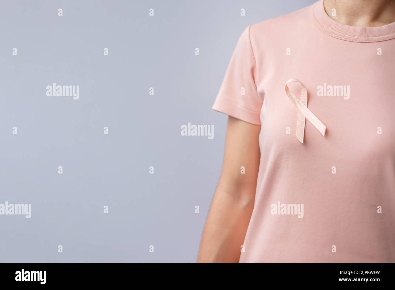 Peach Ribbon for September Uterine Cancer Awareness month. Healthcare ...