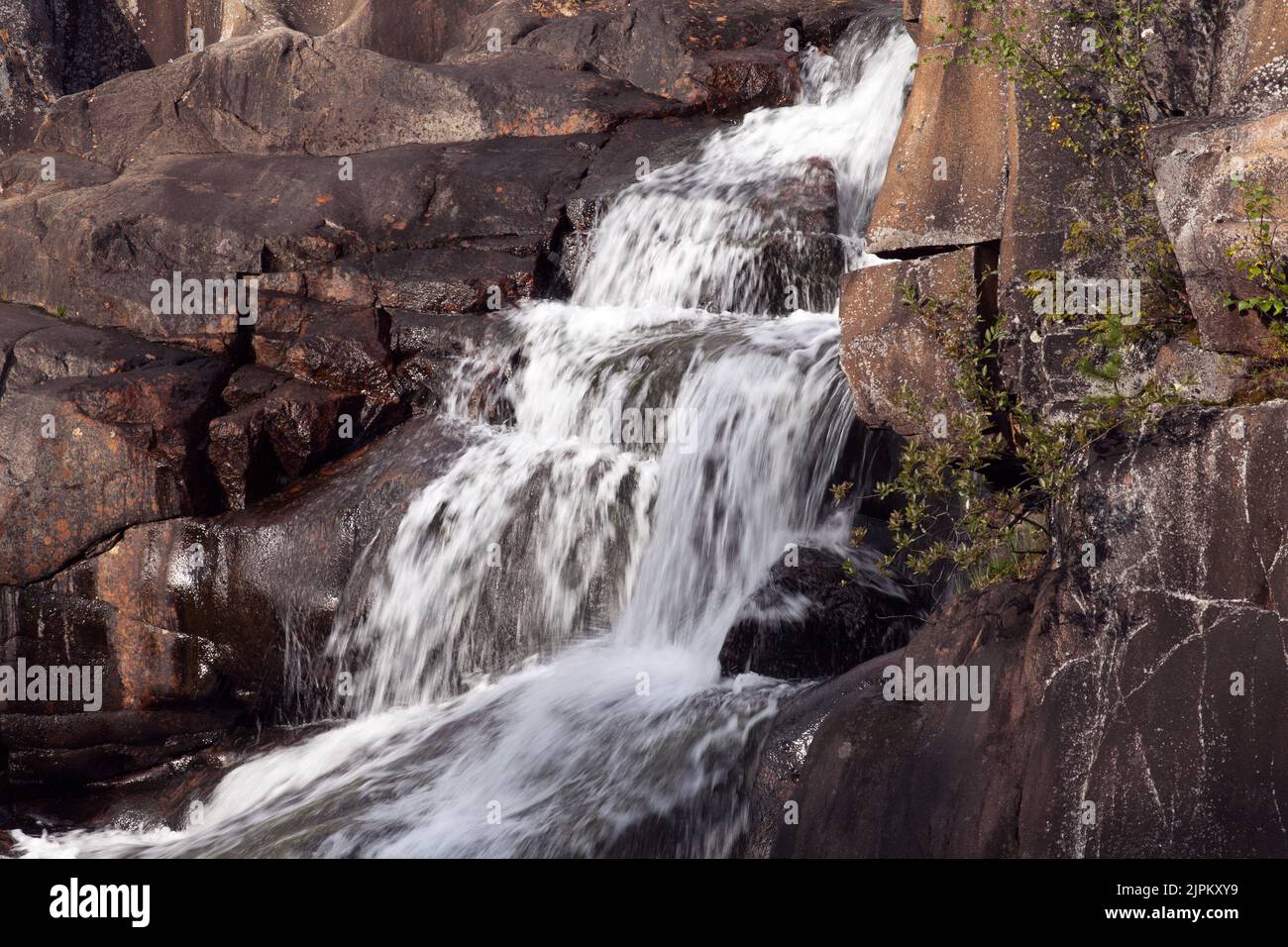 The Cascades of water in the big river. Powerful stream down the valley ...