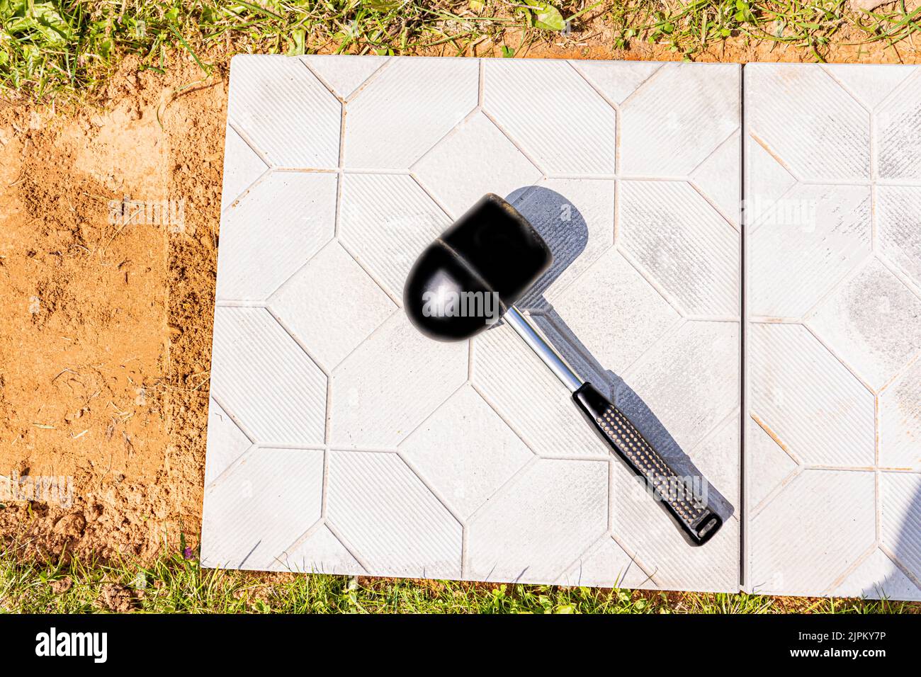 rubber construction hammer for laying paving or garden tiles in the ...
