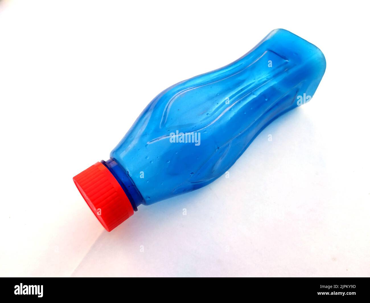 Blue plastick water bottle isolated on white background Stock Photo - Alamy