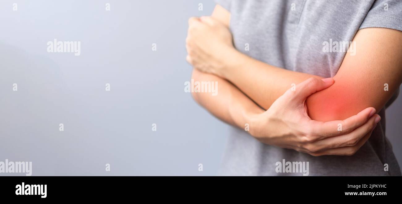 adult female with her muscle pain on gray background. Woman having ...