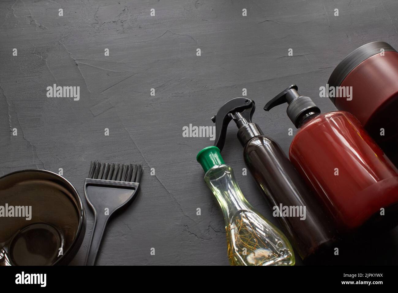 Top view of a professional hairdresser kit with copy space on a black ...