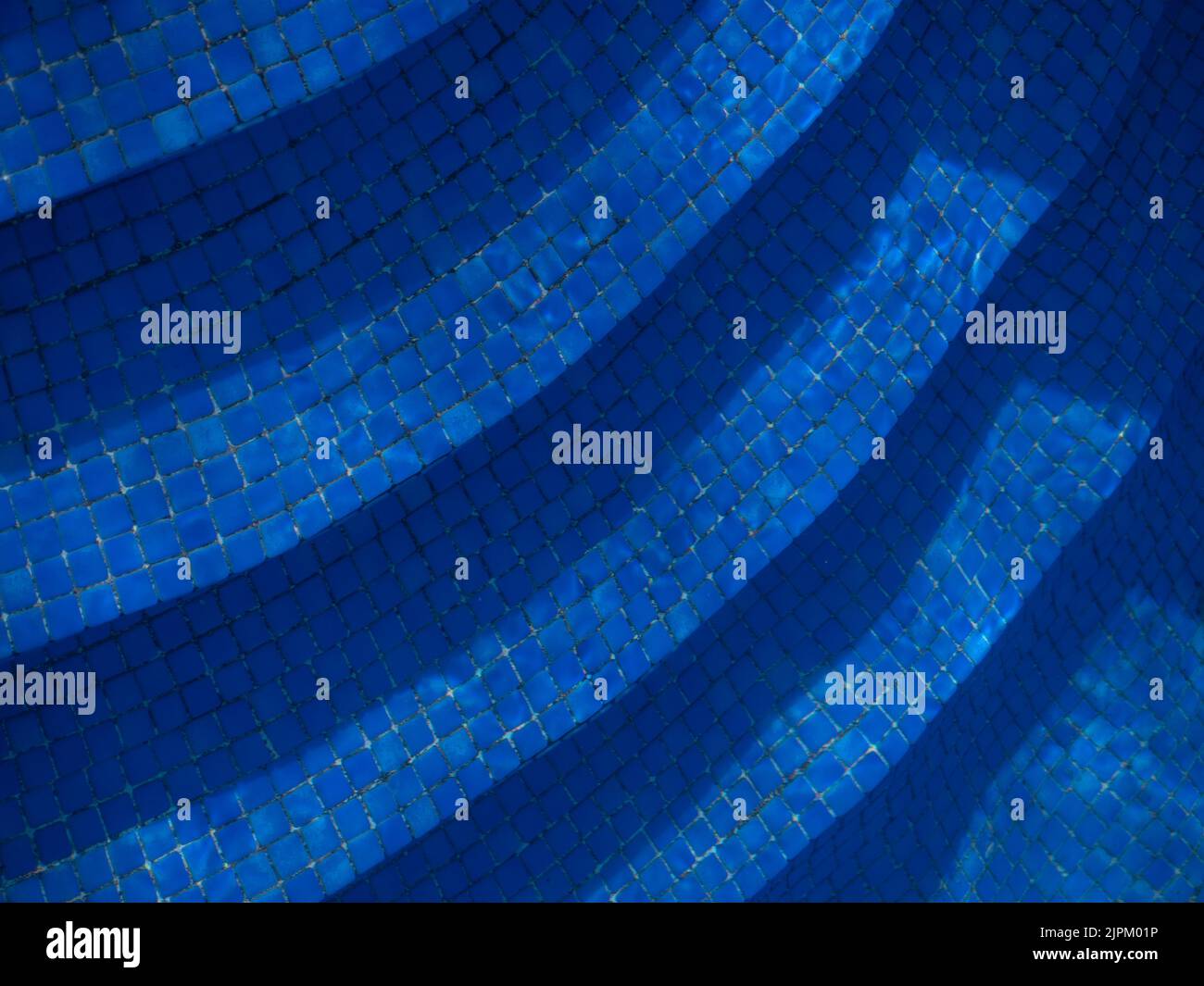 View of stairs leading to a swimming pool. Mosaic pattern tiles Stock ...