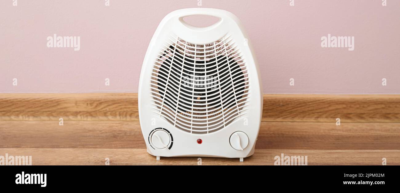 Electric fan heater on floor. Banner for design Stock Photo - Alamy
