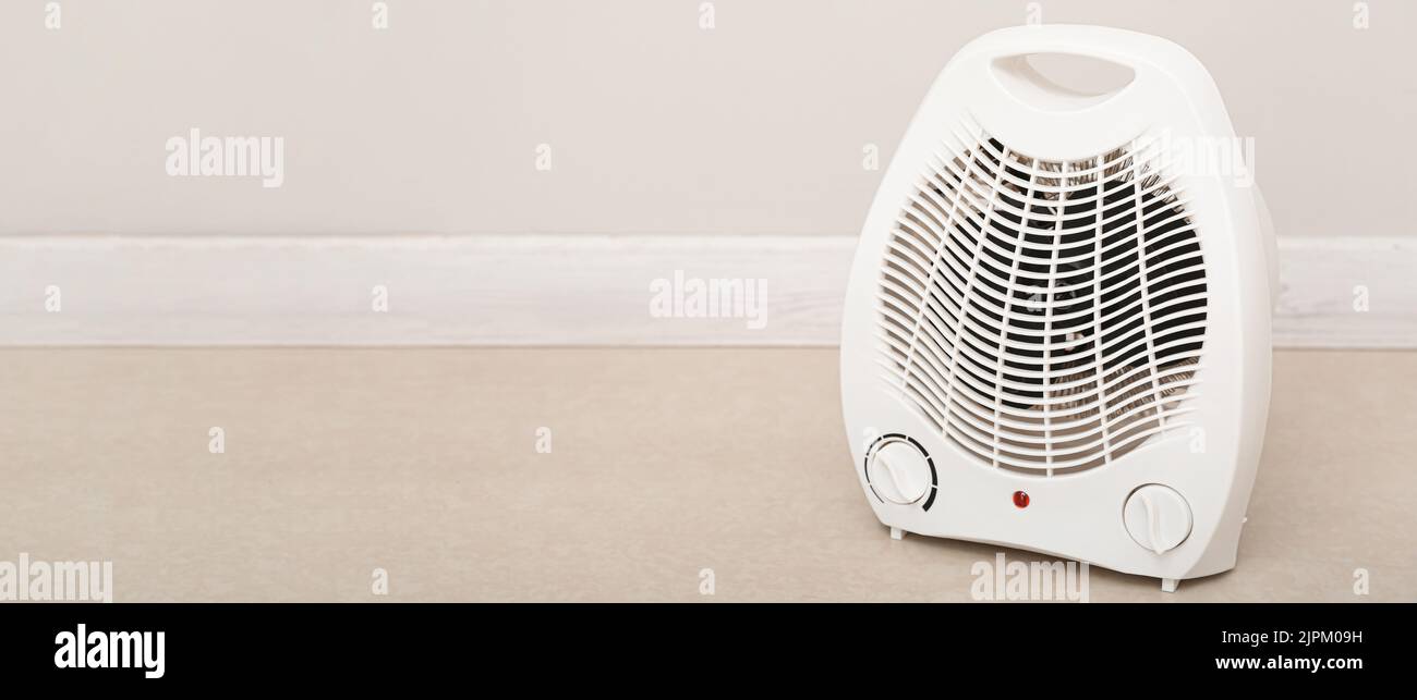 Electric fan heater on floor. Banner for design Stock Photo - Alamy