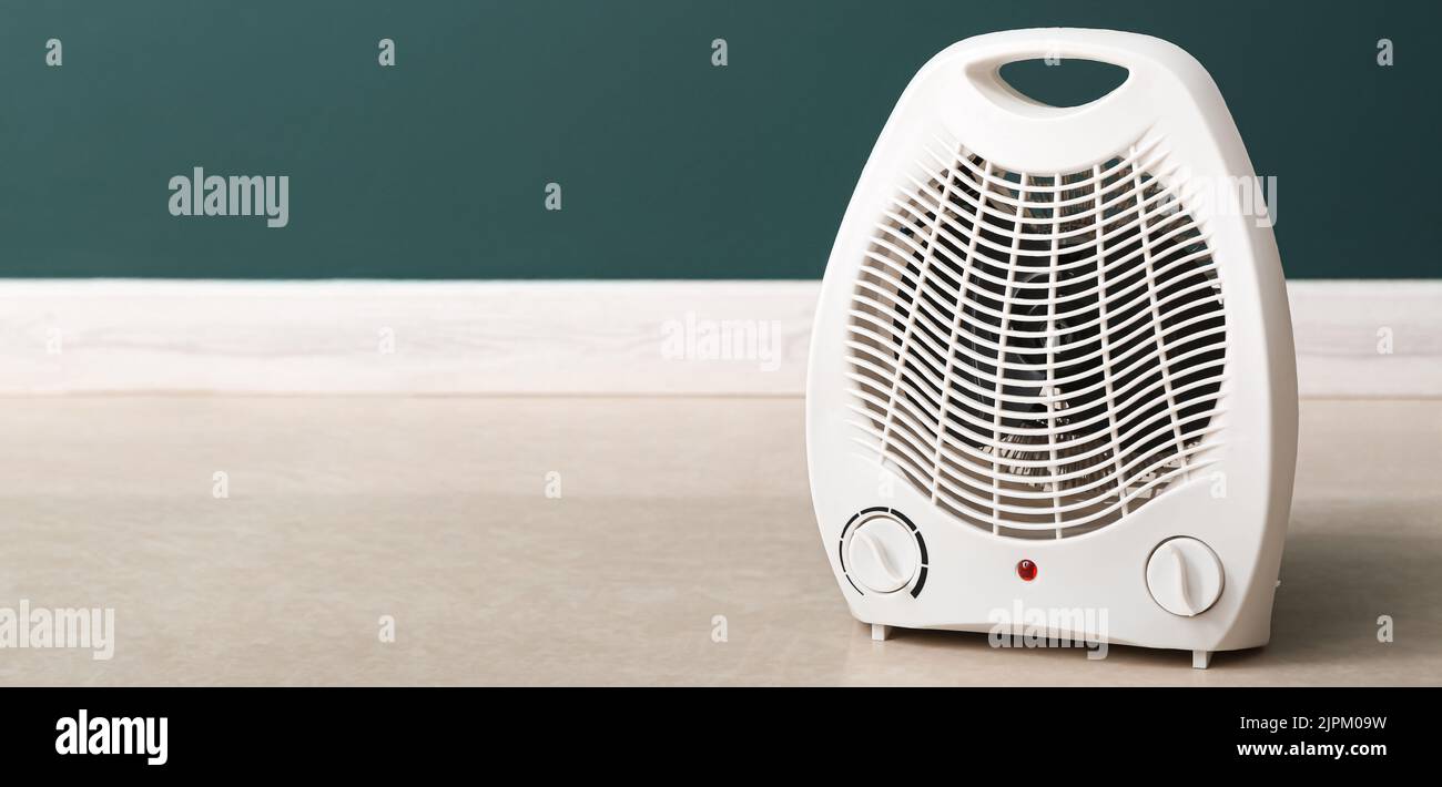 Electric fan heater on floor. Banner for design Stock Photo - Alamy