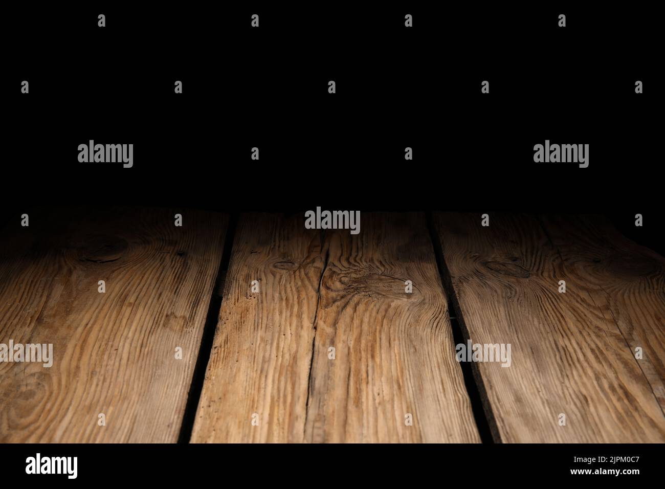 Wooden table top on black background Stock Photo - Alamy