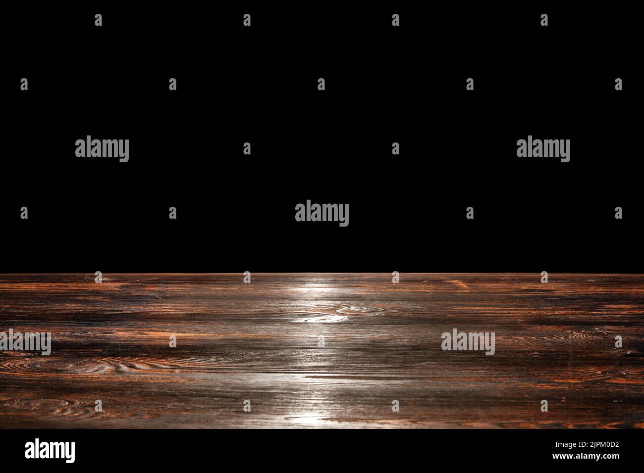Wooden table top on black background Stock Photo - Alamy