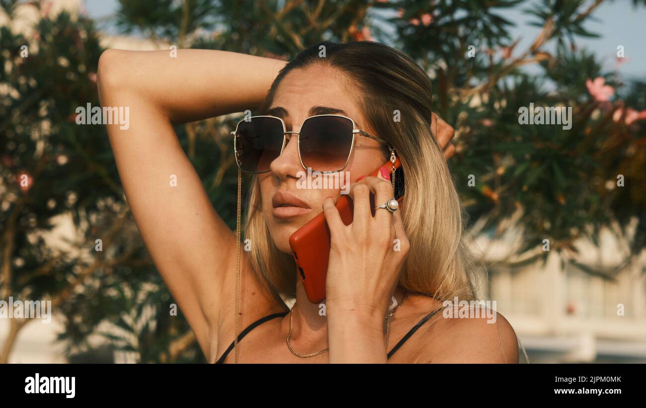 The lady is waiting for an answer to her question on the phone Stock ...