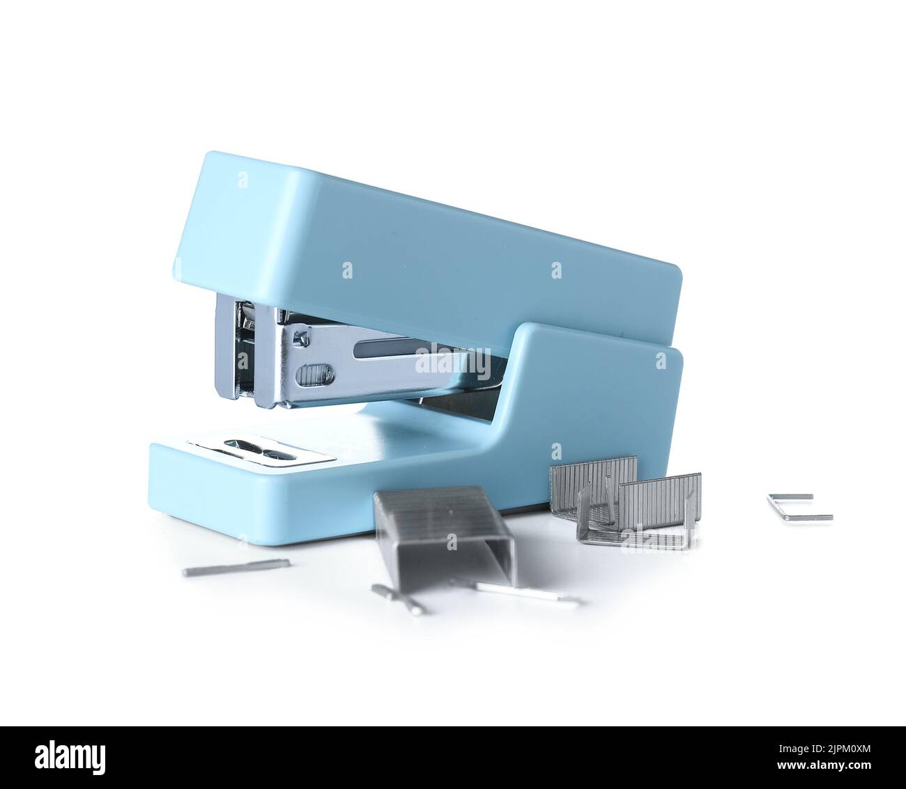 Blue stapler with staples on white background Stock Photo - Alamy