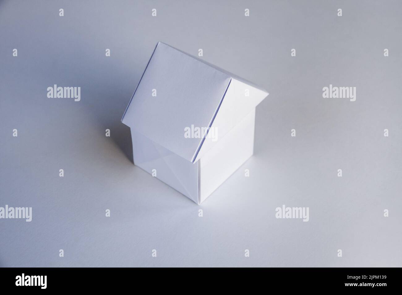Paper house origami isolated on a blank white background Stock Photo ...