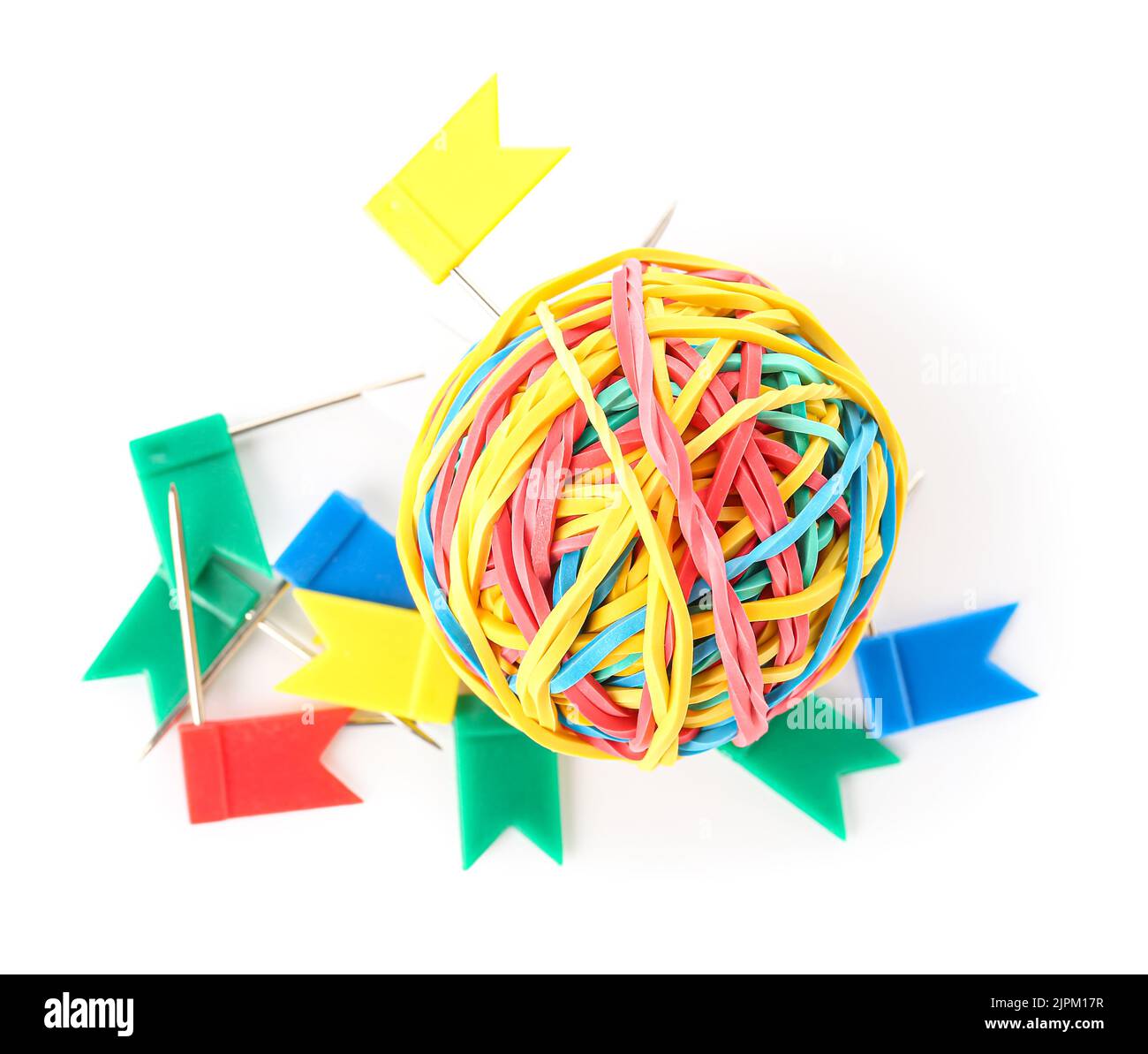 Colorful rubber band ball and paper pins on white background Stock ...