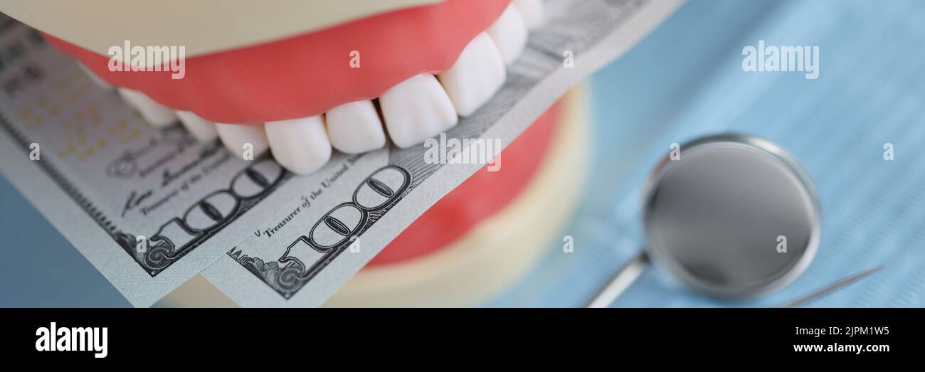 Artificial teeth in fake dentures. Dentist instruments for healthcare ...