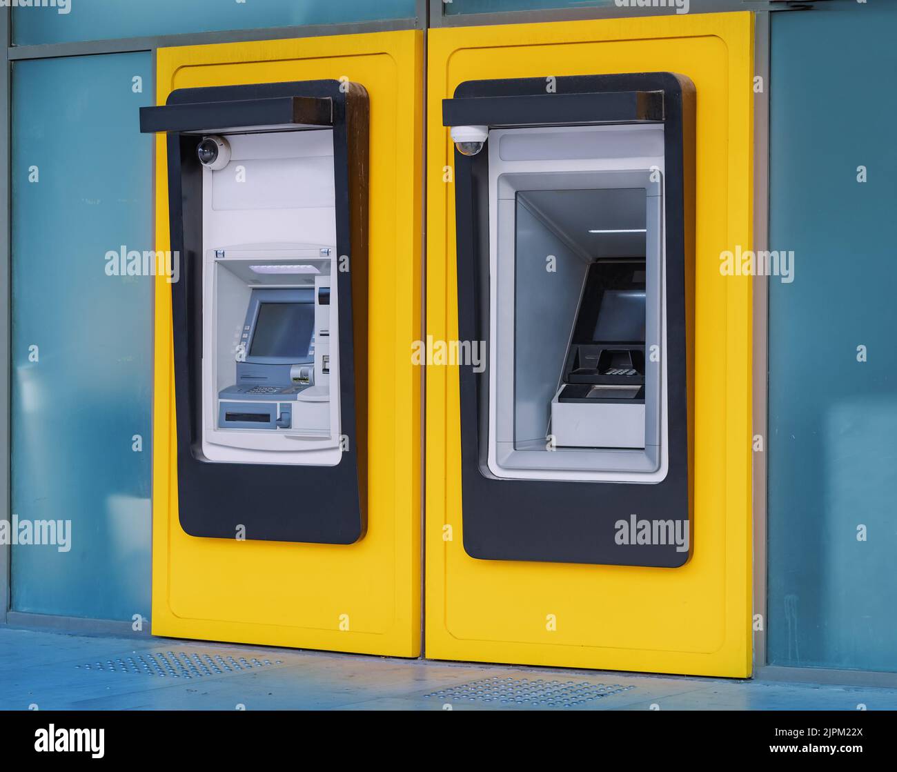 ATMs are built into the wall of the bank building. The concept of ...