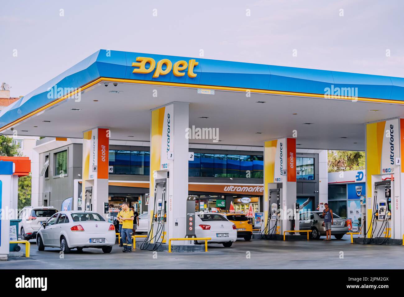 10 July 2022, Antalya, Turkey: Motorists fill their cars with gasoline ...