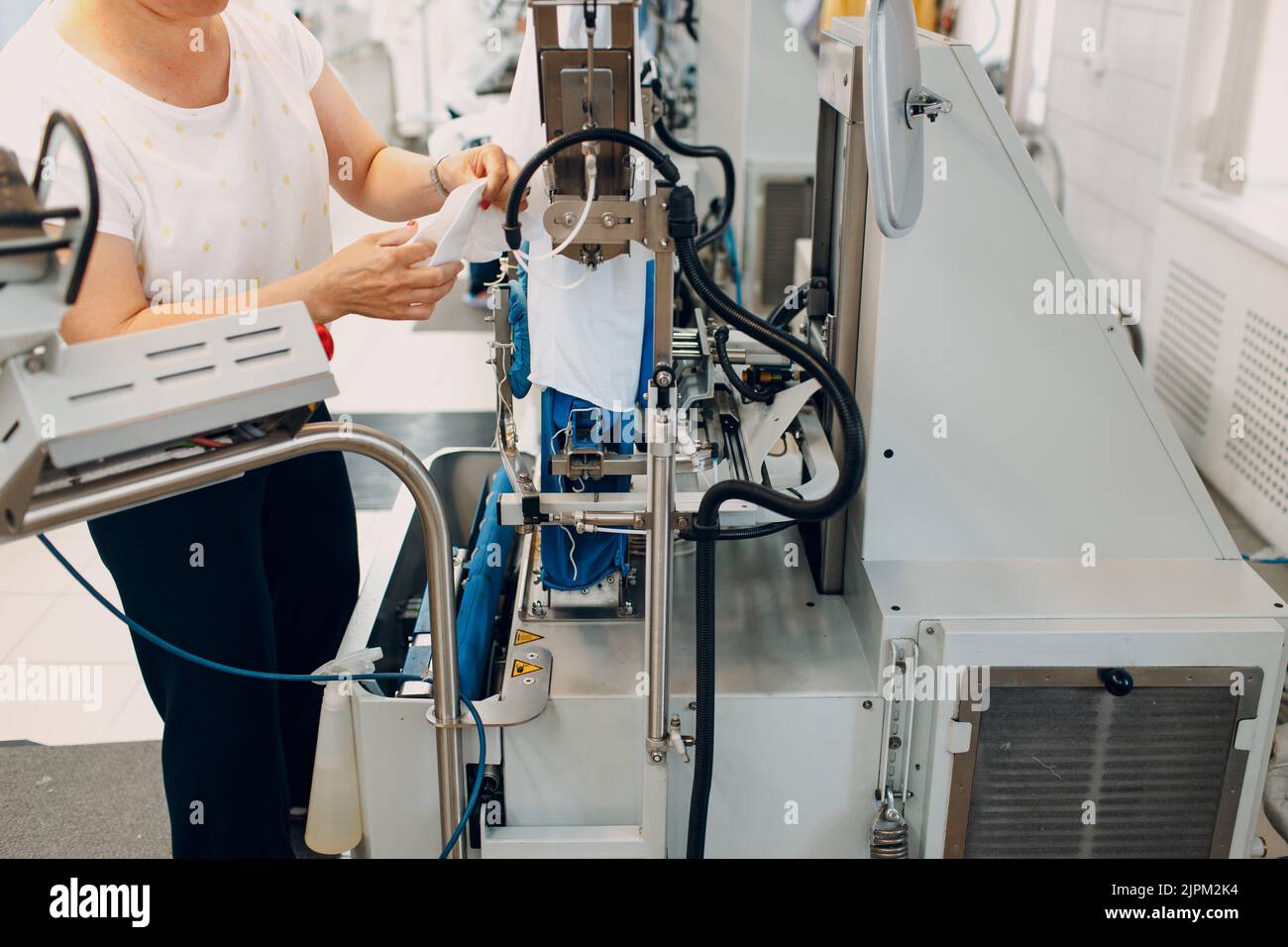 Dry cleaning clothes. Clean cloth chemical process. Laundry industrial ...